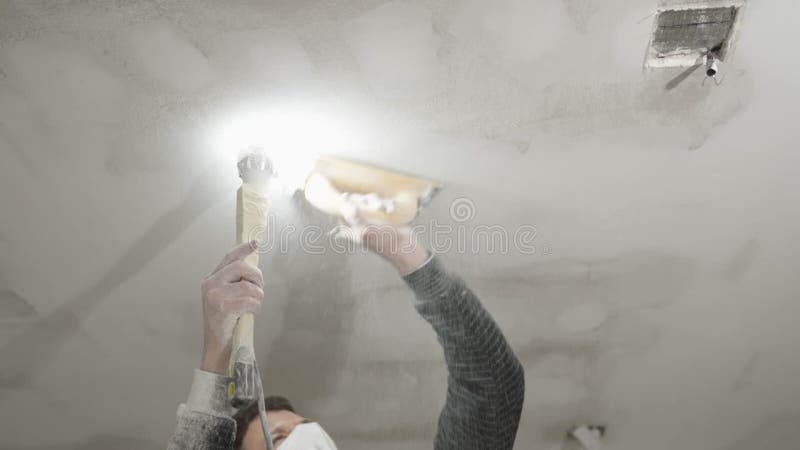 Hand Sanding of the Plasterboard Ceiling with a Trowel Stock Video ...