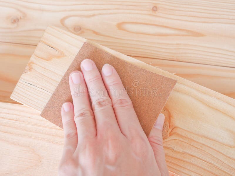 Hand sanding wooden pallet stock image. Image of surface - 386166755