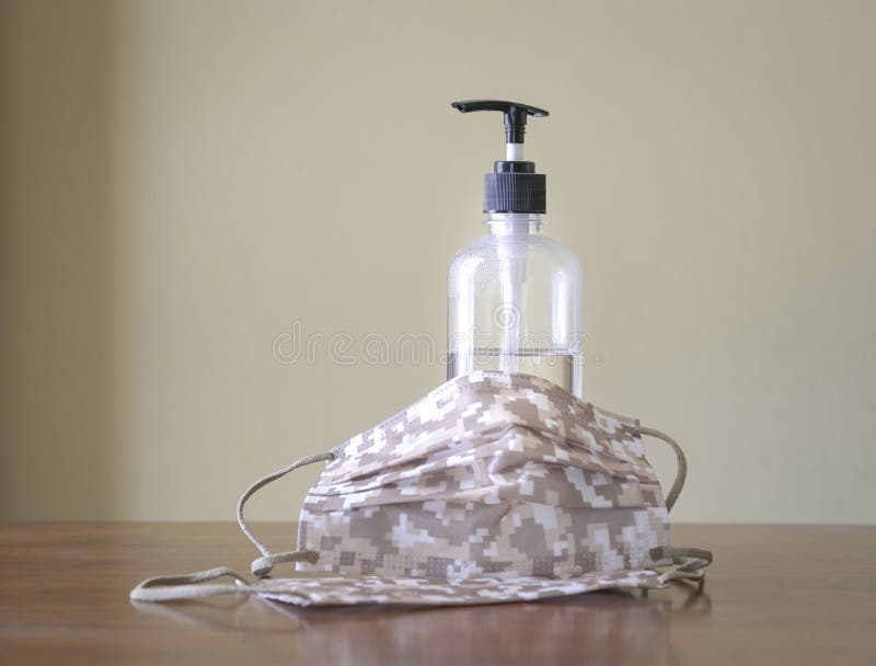 Hand Sanitizer and Face Masks on Table Stock Image - Image of mask ...