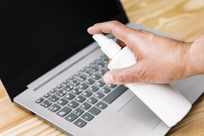 Hand Sanitizing Computer with Antibacterial Spray Stock Image - Image ...
