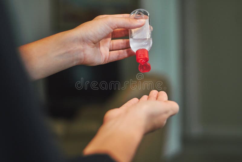 Hand sanitizing at home stock image. Image of germs - 257122235