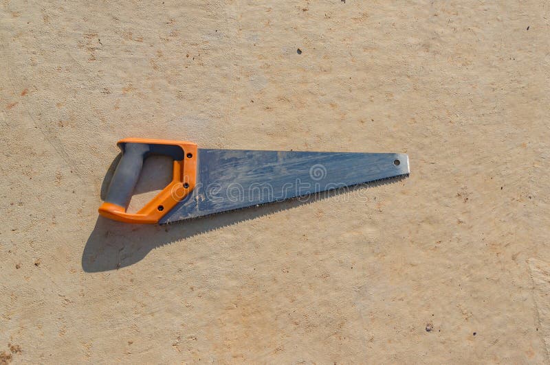 Hand Saw on Concrete Texture Background. Construction Tools Still Life ...