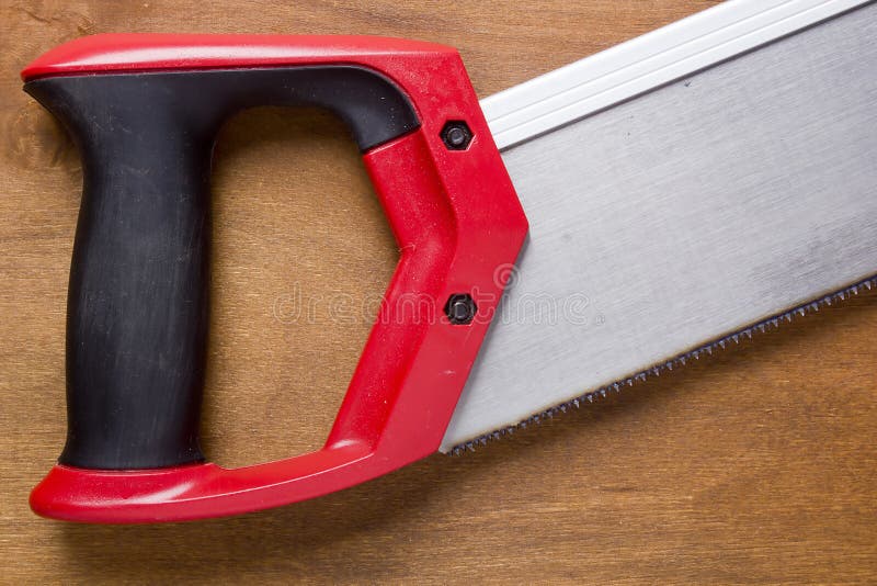 Hand saw with a red handle stock photo. Image of blade - 66754674