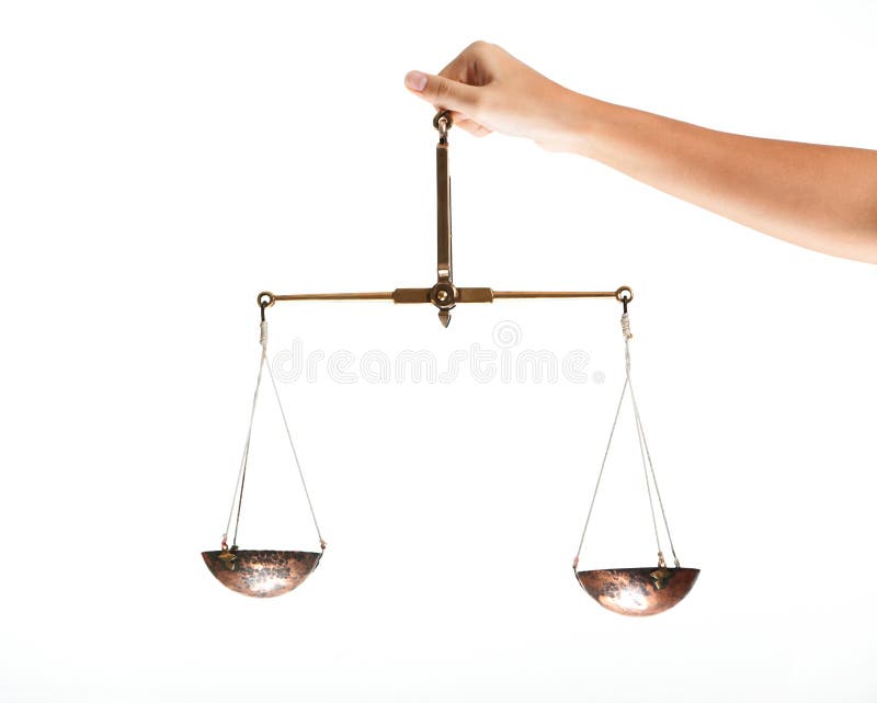 Dolls on Balancing Scales stock photo. Image of inside - 11860974