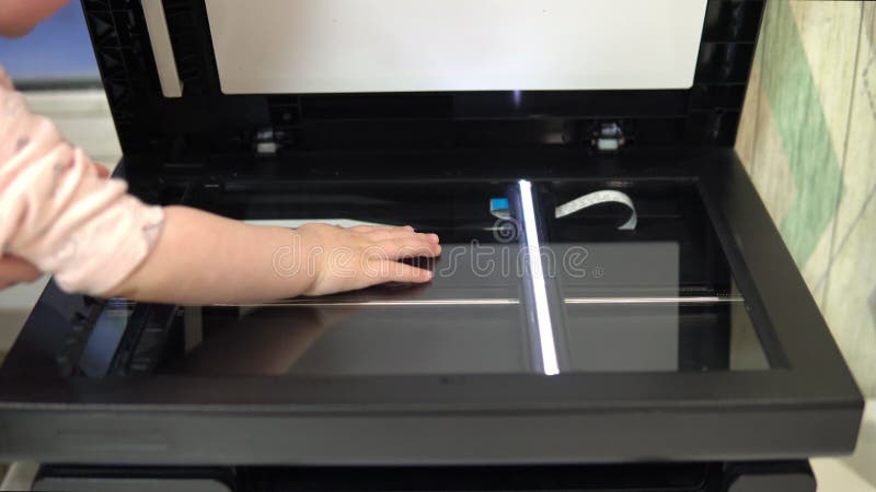 Hand Scanning Process. Scanner in Operation Scans a Human Hand with the ...