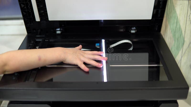 Hand Scanning Process. Scanner in Operation Scans a Human Hand with the ...