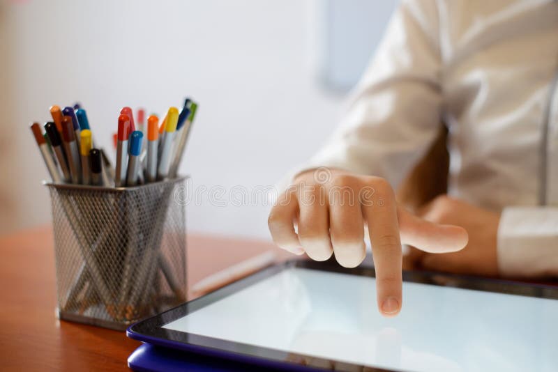 Hand of a Schoolgirl on a Big Screen of Touch Pad. Stock Image - Image ...