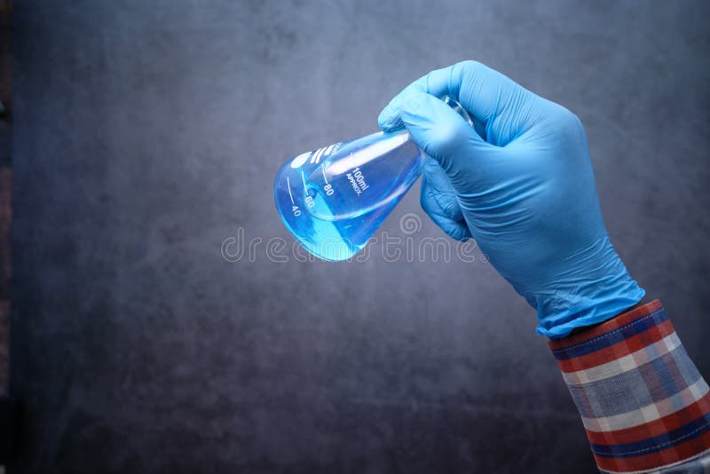 Hand of Scientist Holding Lab Glassware Top Down. Stock Image - Image ...