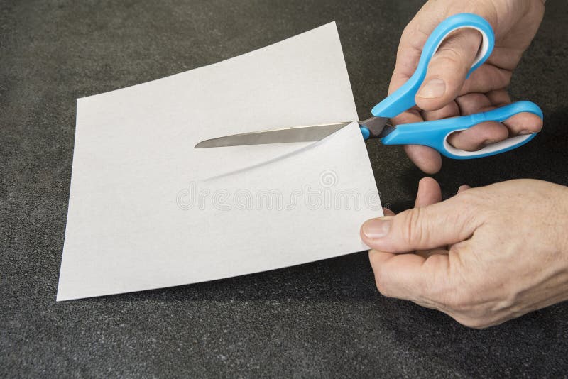 Hand with Scissors is Cutting the Paper Stock Photo - Image of metal ...