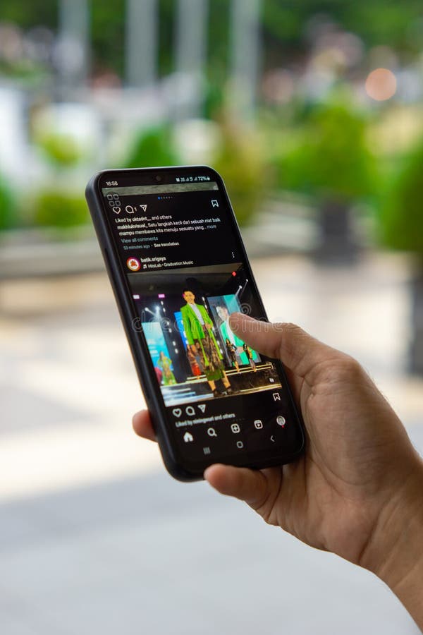 A Hand is Scrolling Instagram Looking for Some Entertainment in Leisure ...