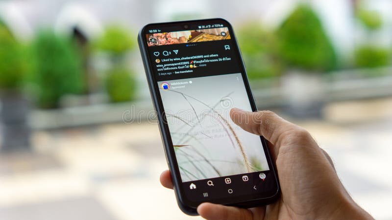A Hand is Scrolling Instagram Looking for Some Entertainment in Leisure ...
