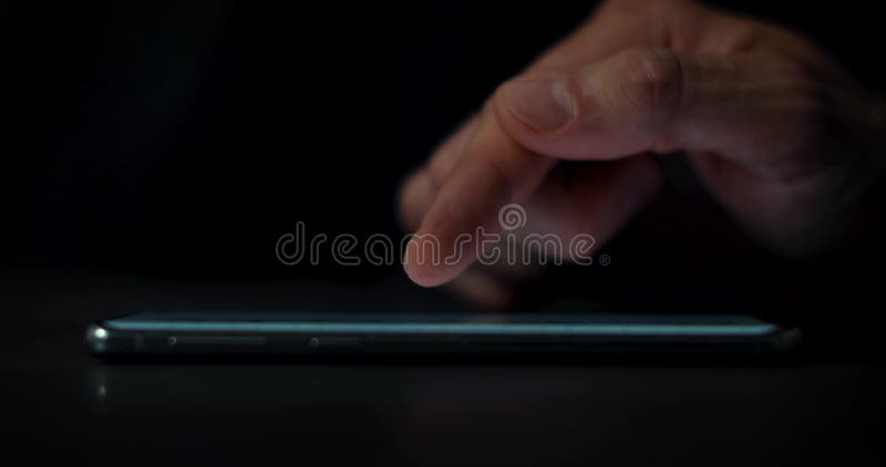 Hand Scrolling Phone Screen in the Dark Stock Footage - Video of ...