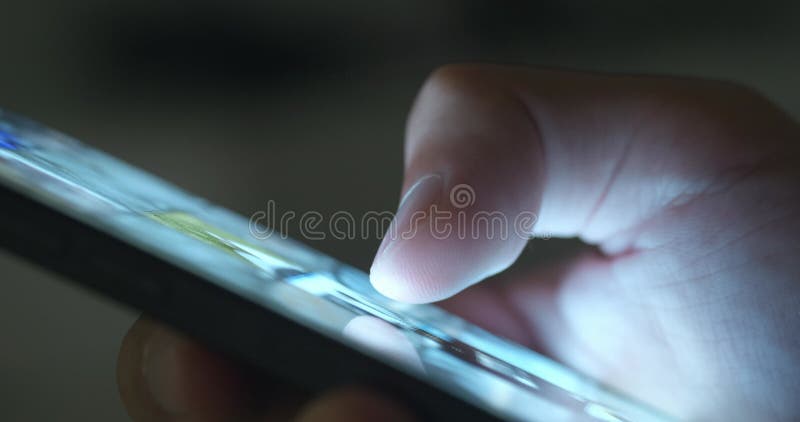 Hand Scrolls through Content Smartphone Dark. Showcasing Technology Its ...