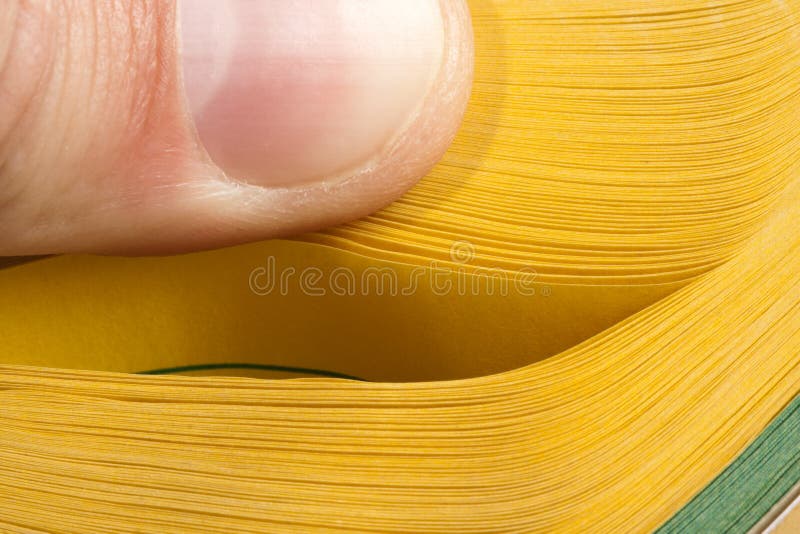 Hand Searching the Yellow Pages Stock Image - Image of point ...
