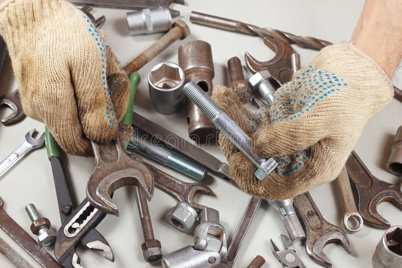 Hand of Serviceman in Gloves with Tools for Repairing Machines in ...