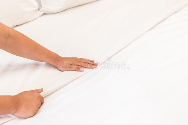 Hand Set Up White Bed Sheet in Hotel Room Stock Photo - Image of care ...