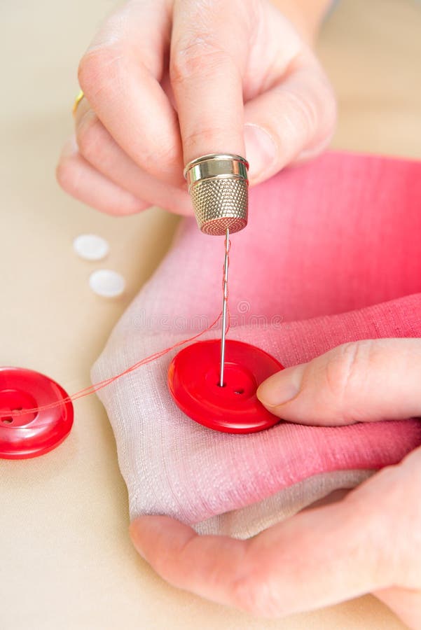 Hand Sewing Button on Fabric Stock Image - Image of handicraft, stitch ...