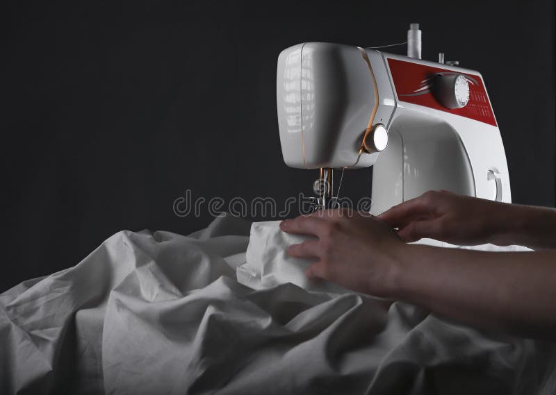 Hand at Sewing Machine during Working Process with Textile Stock Photo ...