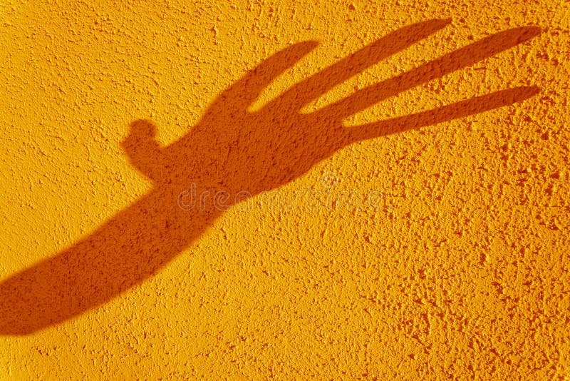 Hand Shadow Distorted on Texturized Yellow Wall Stock Photo - Image of ...