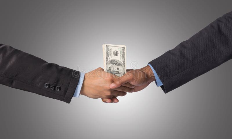 Hand Shake between a Businessman with Dollar Money on Dark Blue Stock ...