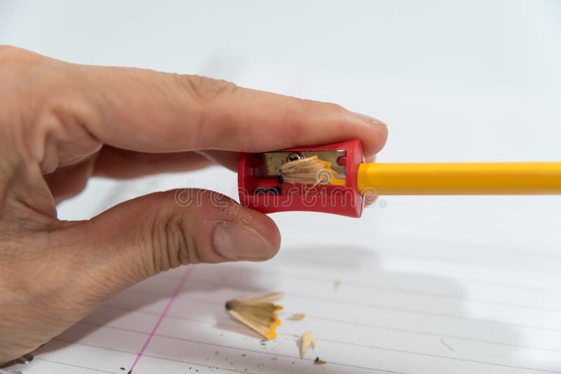 Hand Sharpening a Pencil with a Sharpener Stock Photo - Image of ...