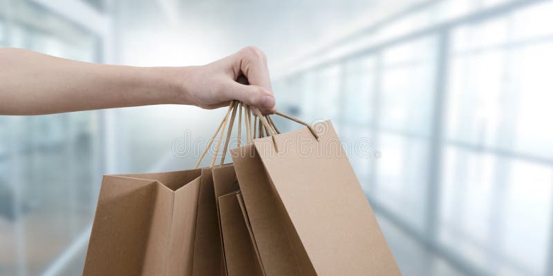 Hand with shopping bags stock photo. Image of gift, consumer - 128753992