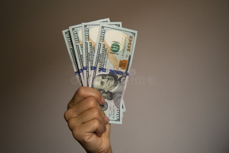 Hand Holding Notes of One Hundred Dollars. Stock Image - Image of large ...