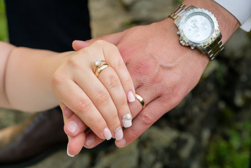 Hand in Hand Showing Wedding Rings Stock Photo - Image of photograph ...