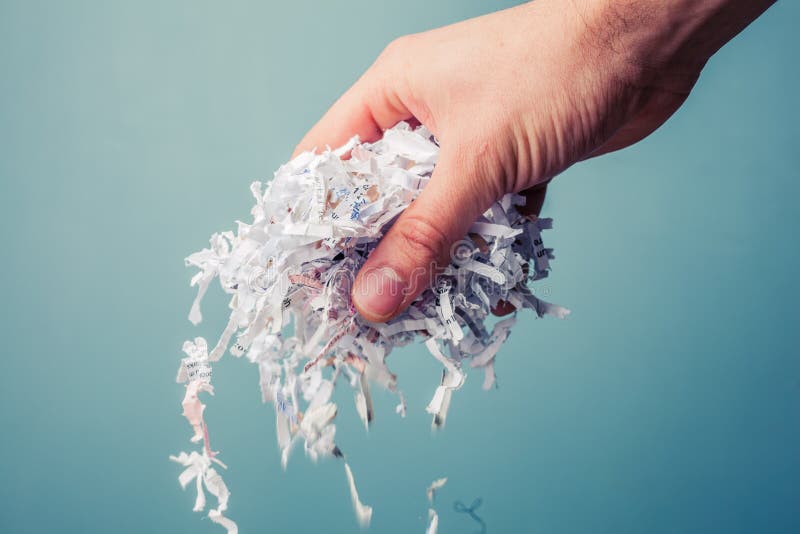 Hand with shredded paper stock photo. Image of shredder - 37871158