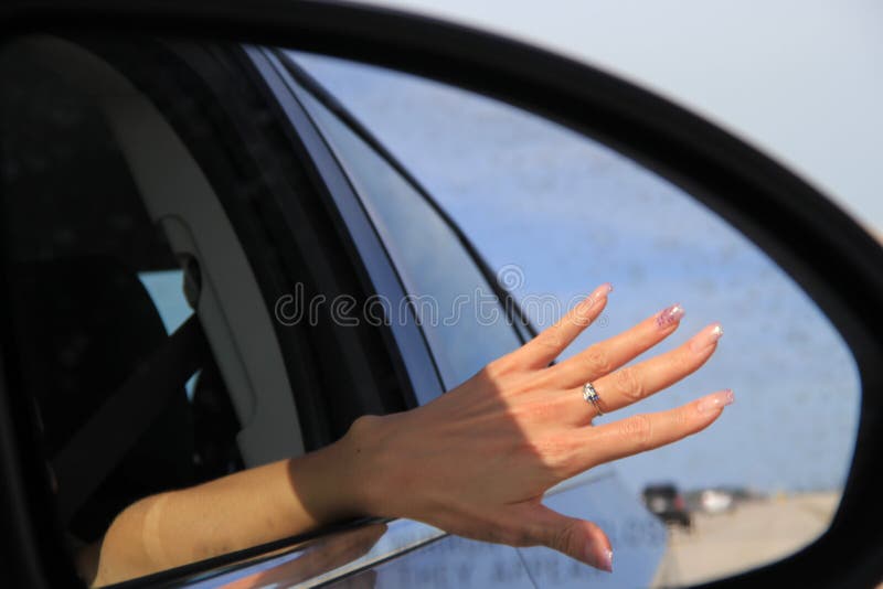 Hand in side view mirror stock image. Image of mirror - 90156031