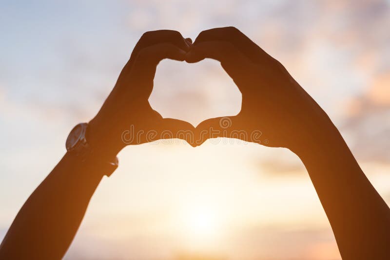 Hands Forming a Shape with Sunset Silhouette Stock Image - Image of ...