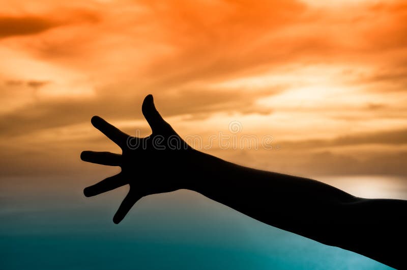 Hand Silhouette Under Sunset Stock Photo - Image of freedom, orange ...