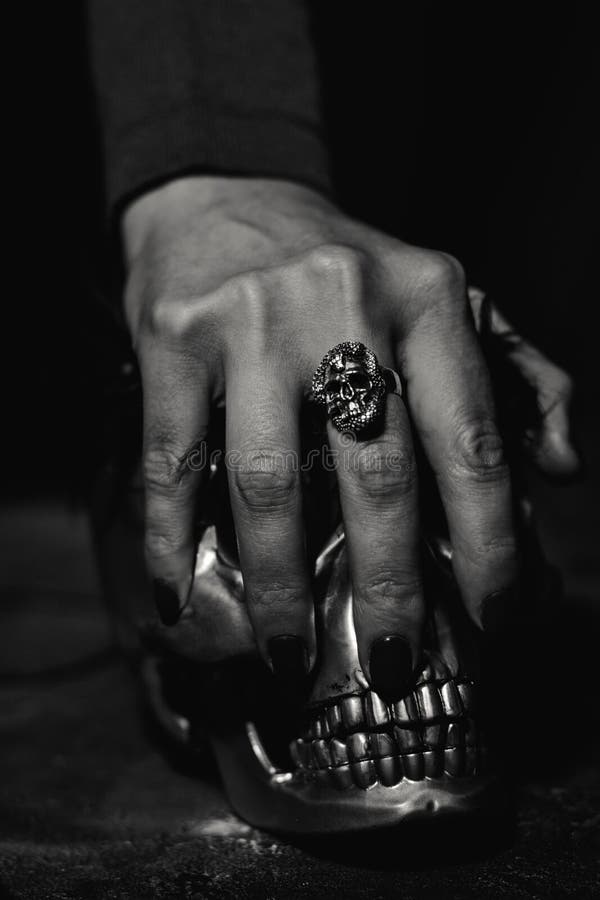 Hand with Silver Scull Shape Ring Holding Scull Stock Photo - Image of ...