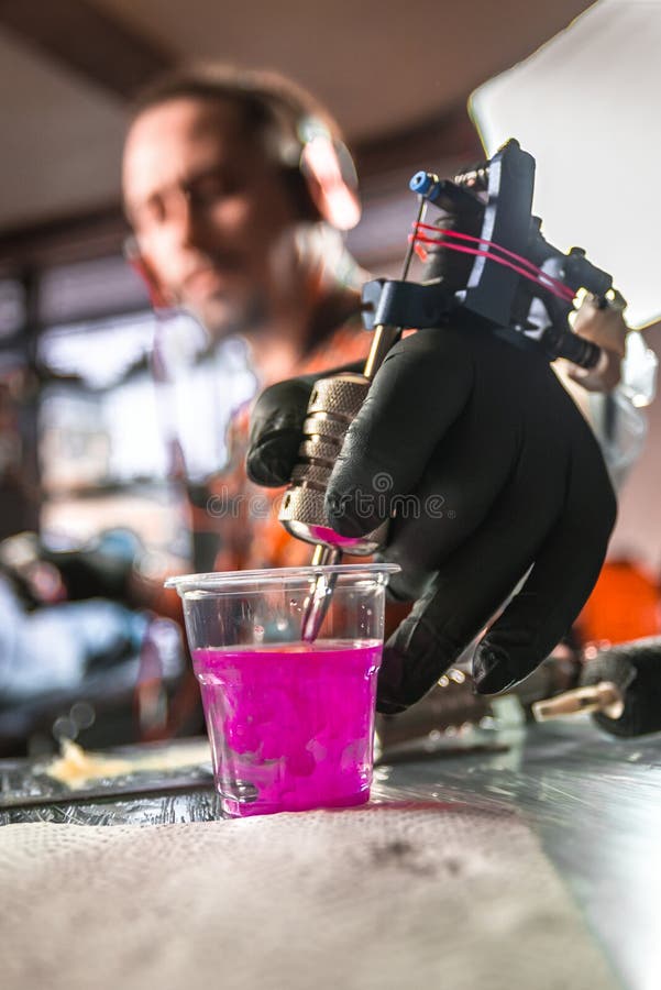 Hand of Skin Master and a Tattoo Gun. Stock Photo - Image of real ... Hand of Skin Master and a Tattoo Gun. Stock Photo - Image of real ...