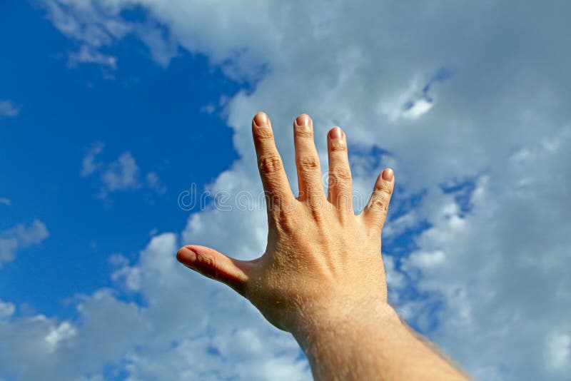 Hand on the Sky stock image. Image of clear, twilight - 63784999