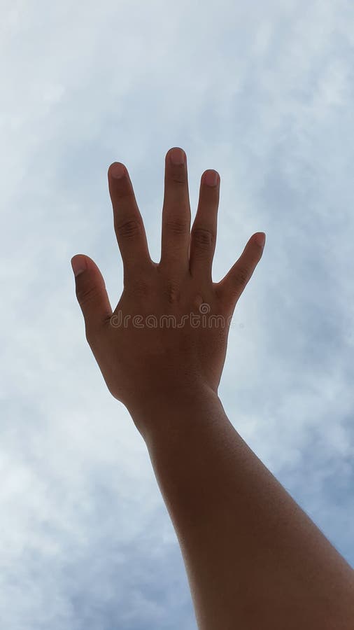 Hand in the sky huhuh stock image. Image of hand, cloud - 222313309