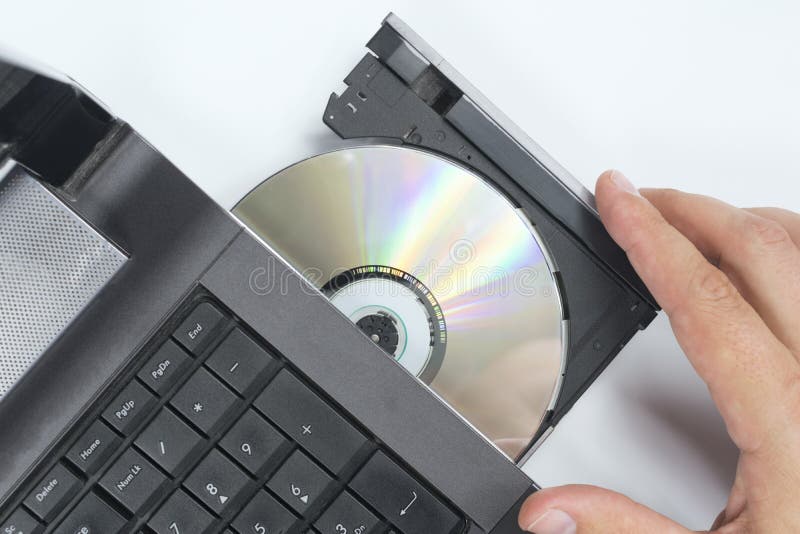 Insert disk into laptop stock image. Image of notebook - 113367669