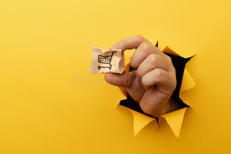 Hand with a Small Broken Delivery Box through a Yellow Paper Hole Stock ...