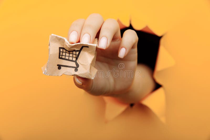 Hand with a Small Broken Delivery Box through a Yellow Paper Hole ...
