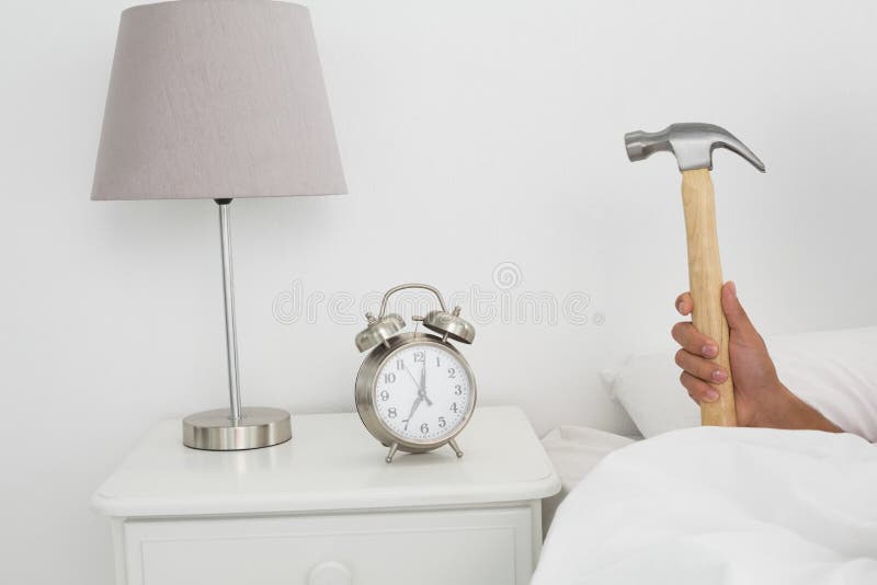Hand Smashing Alarm Clock with Hammer in Bed Stock Image - Image of ...
