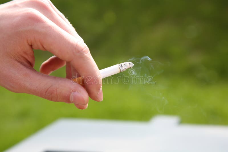 Hand with a Smoking Cigarette Stock Photo - Image of healthy, smoker ...
