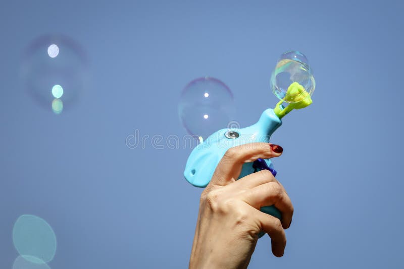 Hand with Soap Bubbles Against the Blue Sky Stock Photo - Image of hand ...