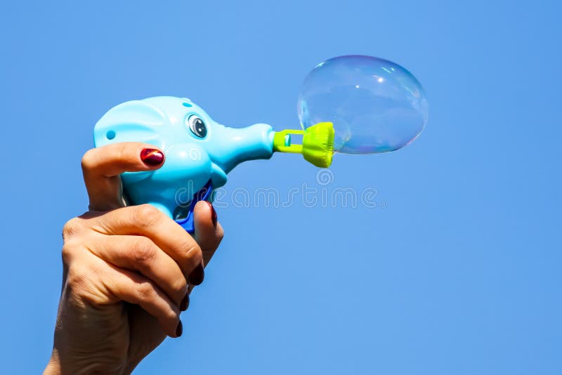 Hand with Soap Bubbles Against the Blue Sky Stock Image - Image of hand ...