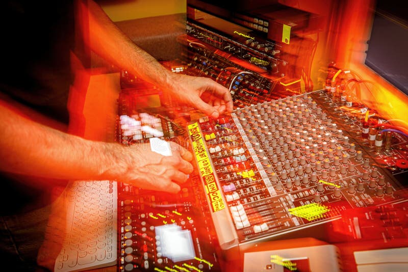 Hand of a Sound Manager on Sound Console Mixer. Equalizer Control ...