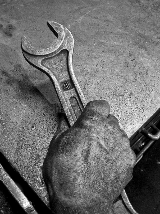 Hand with spanner stock image. Image of dirty, handyman - 34684779