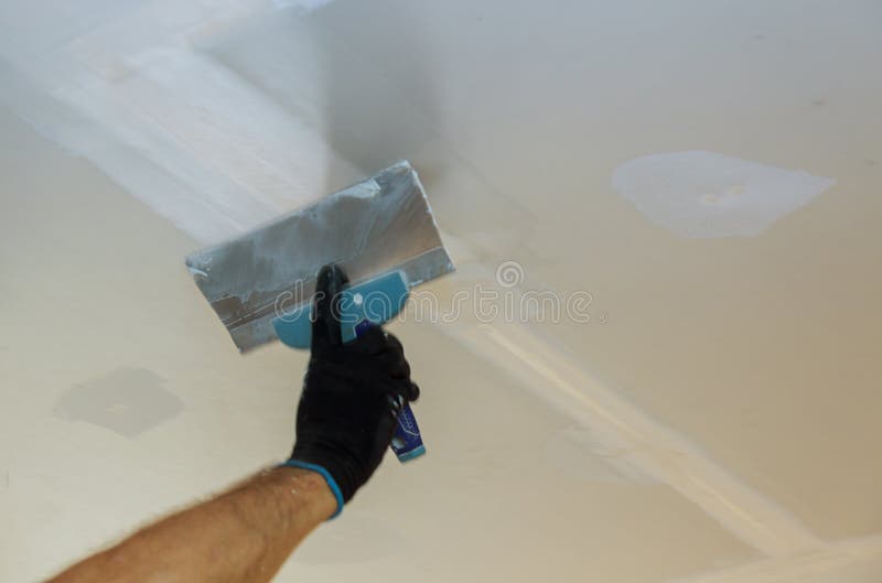 Hand with a Spatula Plaster on a Wall Stock Photo - Image of handyman ...