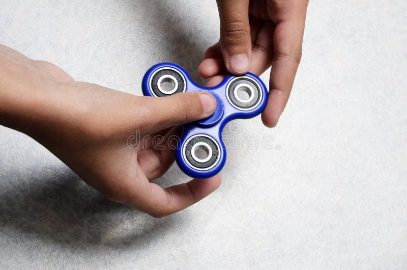 Hand Spinner, Fidgeting Hand Toy Stock Image - Image of leisure, finger ... Hand Spinner, Fidgeting Hand Toy Stock Image - Image of leisure, finger ...