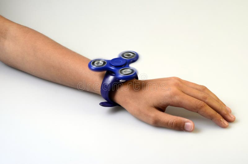 Hand Spinner, Fidgeting Hand Toy Stock Photo - Image of hand, spinner ... Hand Spinner, Fidgeting Hand Toy Stock Photo - Image of hand, spinner ...