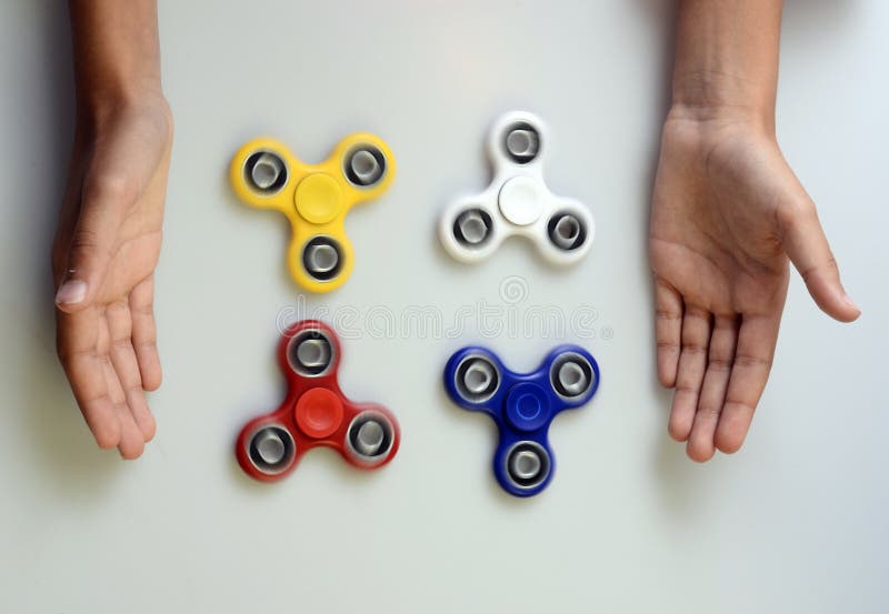 Hand Spinner, Fidgeting Hand Toy Stock Image - Image of hand, white ...
