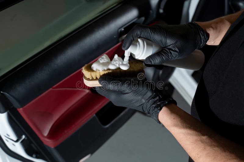 Hand Splashes Flacon of Cleaning Solution in Order To Wipe the Car Door ...